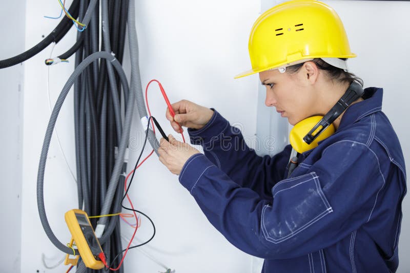 Woman Builder Worker in Uniform Testing Wire Tension Stock Image ...