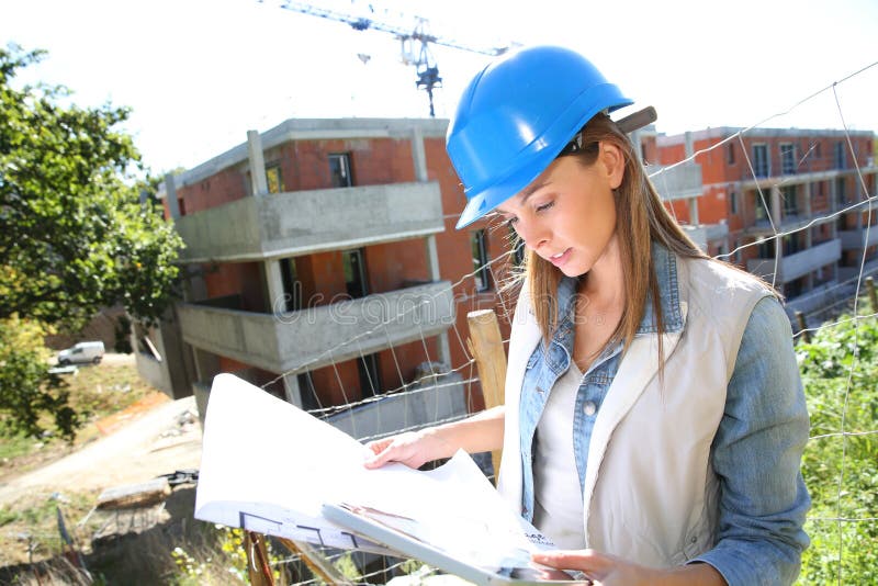 Woman on Building Site with Blueprint Stock Image - Image of helmet ...