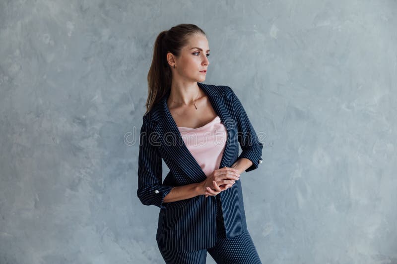 A Woman in a Business Suit in an Office Space in a Room Stock Image ...