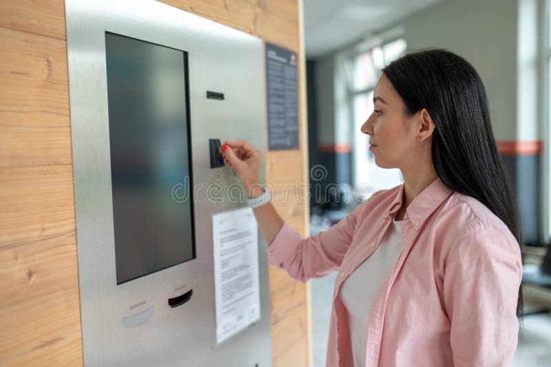 Woman Buying Coffee from Automatic Vending Machine. Stock Photo - Image ...