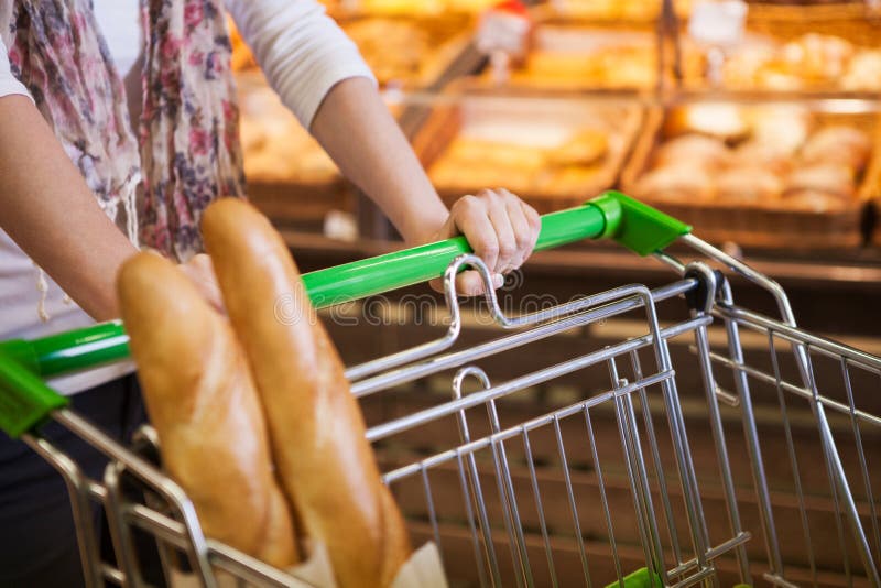 Woman buying fresh bread stock image. Image of eating - 75177671