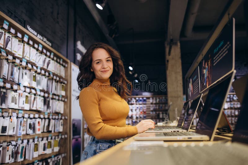Woman Buying a Laptop in Tech Store Stock Photo - Image of retail ...