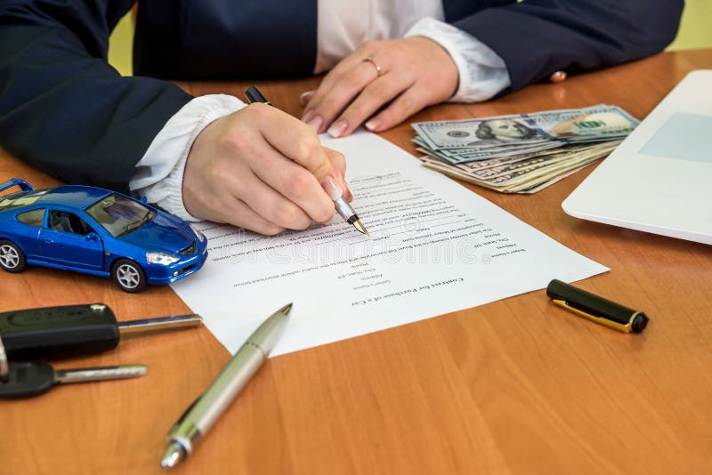 Woman buys a car signing stock photo. Image of office - 128140612