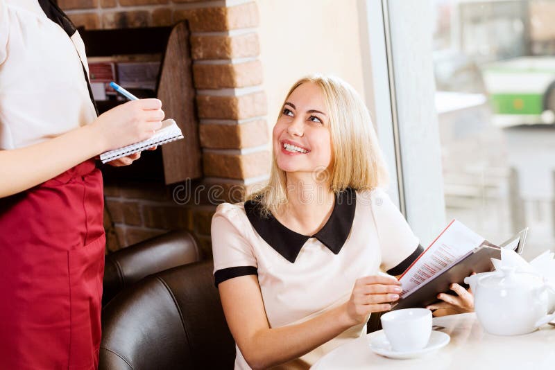 Woman at cafe stock photo. Image of dinner, choice, eating - 38548314