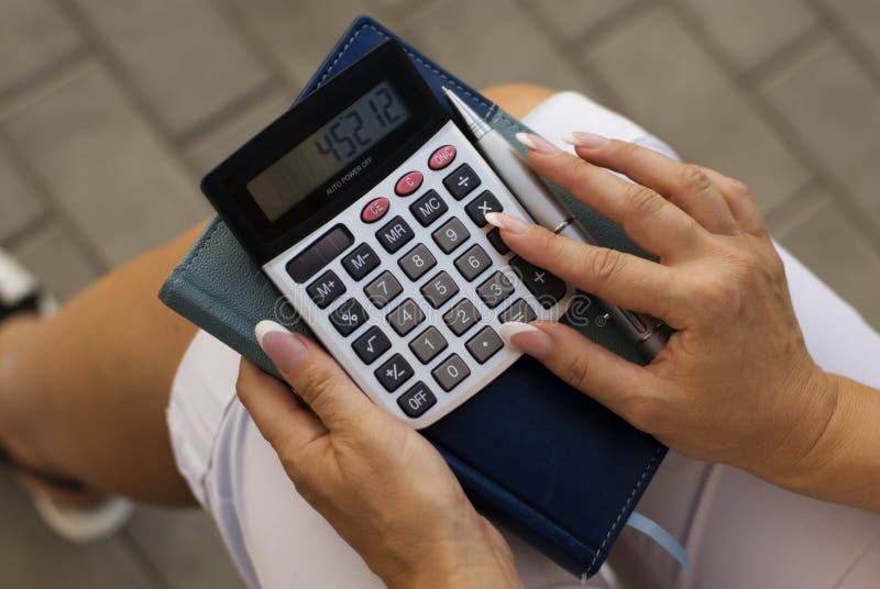 Woman calculating stock image. Image of finger, costs - 6756077