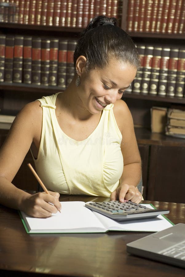 Woman with Calculator stock photo. Image of indoors, american - 6275828