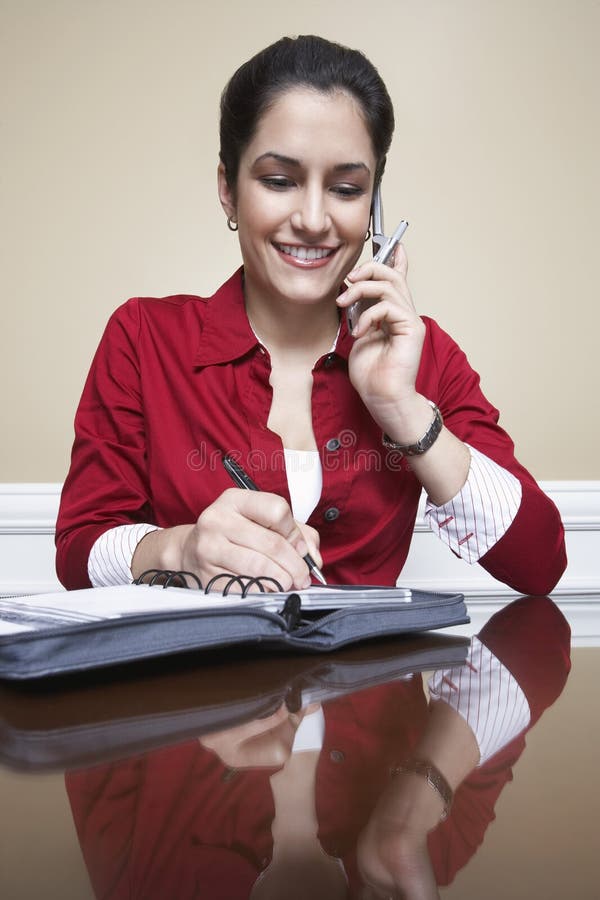 Receptionist On Call Behind Reception Desk Stock Photo - Image of ...