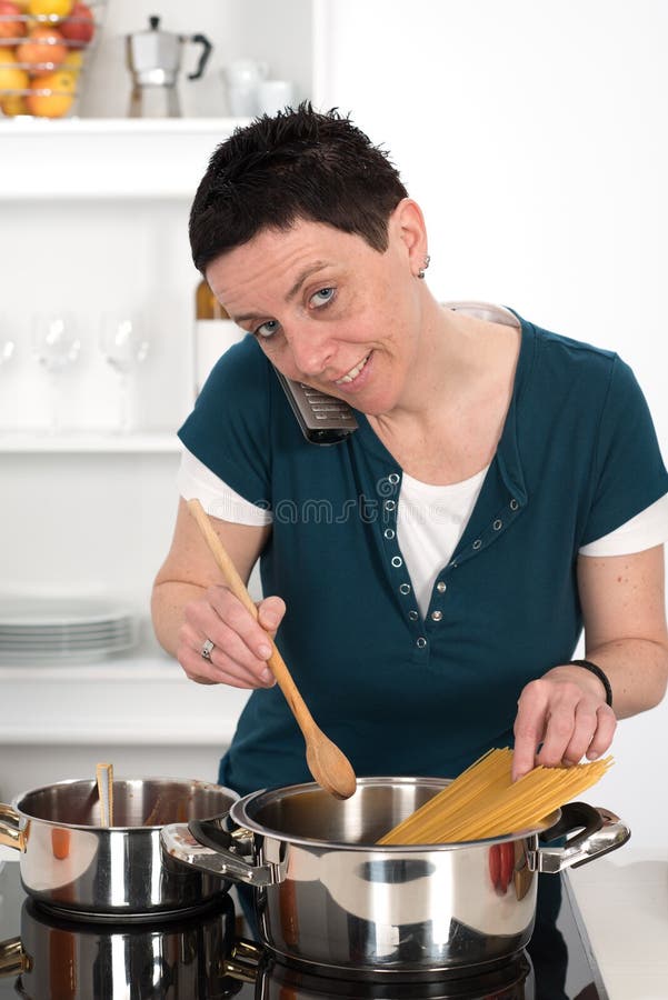 Woman is Calling and Cooking Stock Photo - Image of calling, couple ...