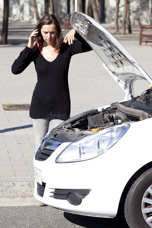 Woman with broken down car stock photo. Image of adult - 14587814