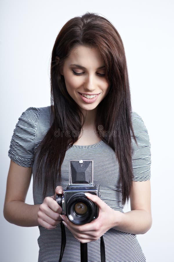 Woman with camera stock photo. Image of holding, brunette - 13249390