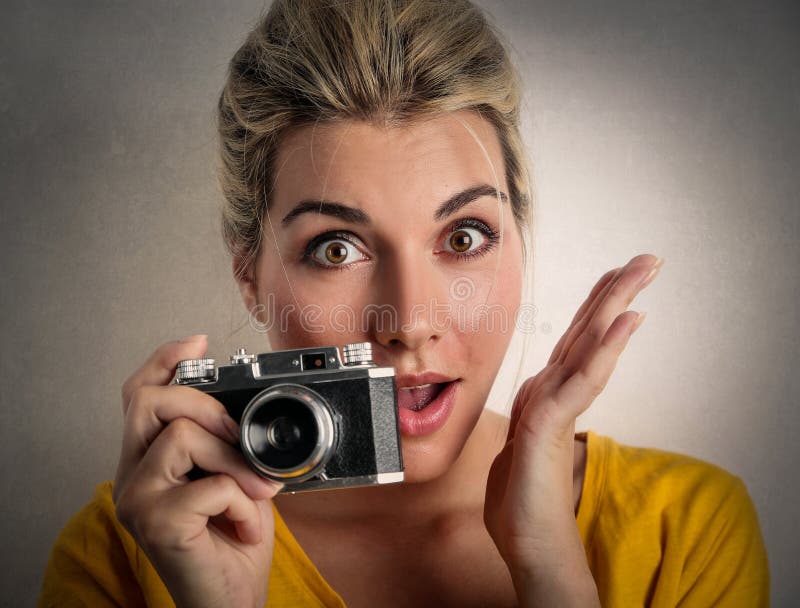 Woman with a camera stock photo. Image of expression - 67499284