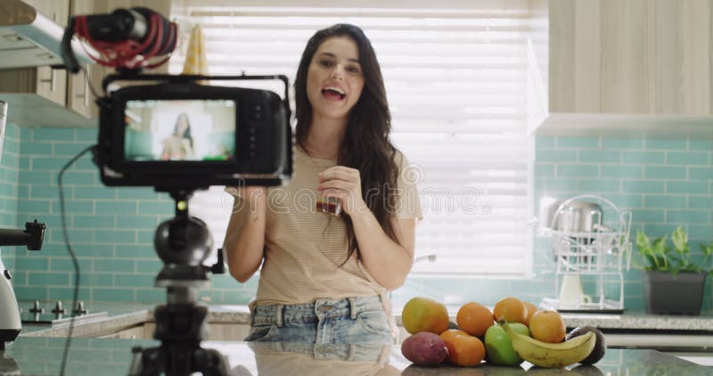 Woman, Camera and Live Streaming in Kitchen, Broadcast and Tutorial or ...