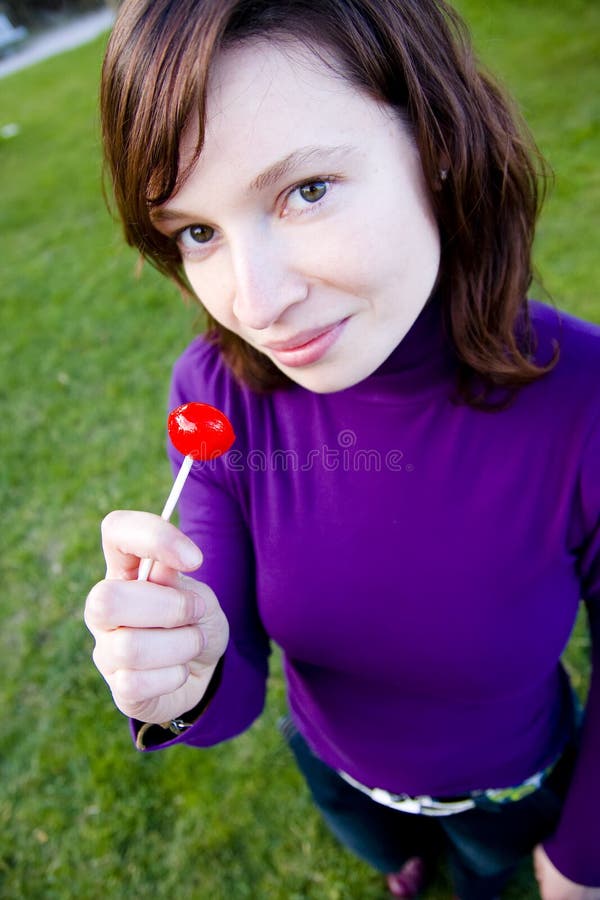Woman with candy stock image. Image of green, enjoyment - 4372269