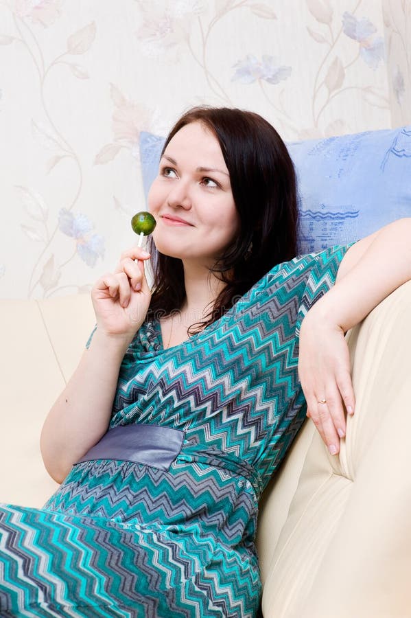 Woman with Candy on the Sofa Stock Image - Image of brunette, pleasure ...