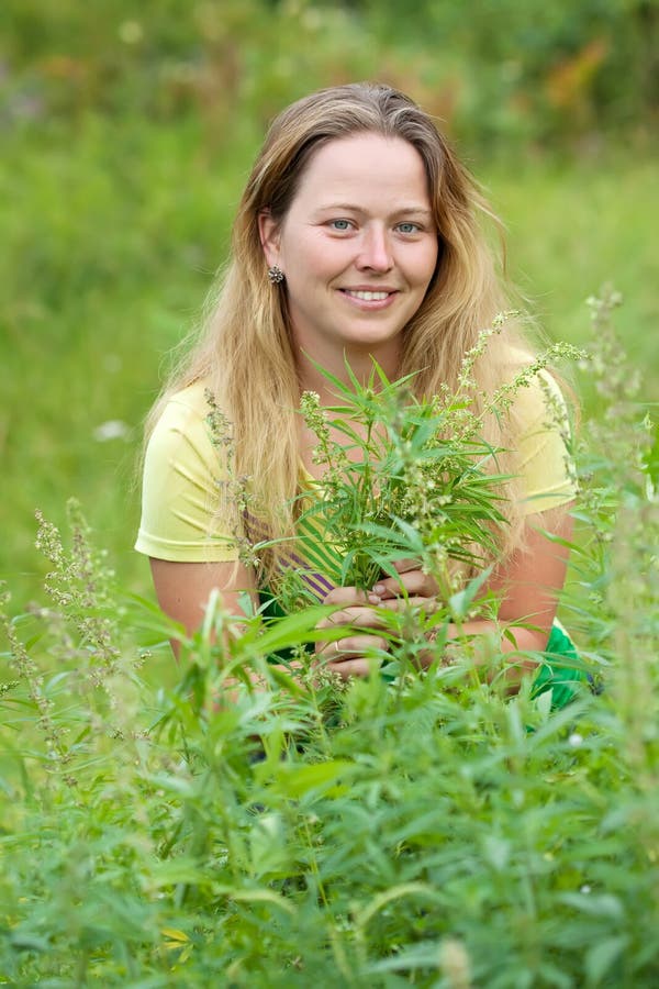 Woman at cannabis plant stock image. Image of green, addiction - 20760397