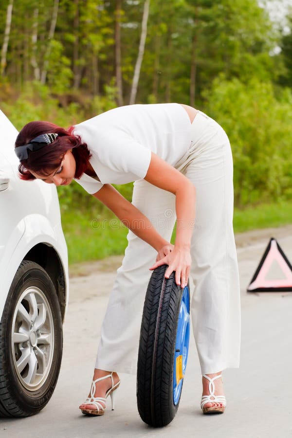Woman and a car stock image. Image of brunette, bumper - 14566293