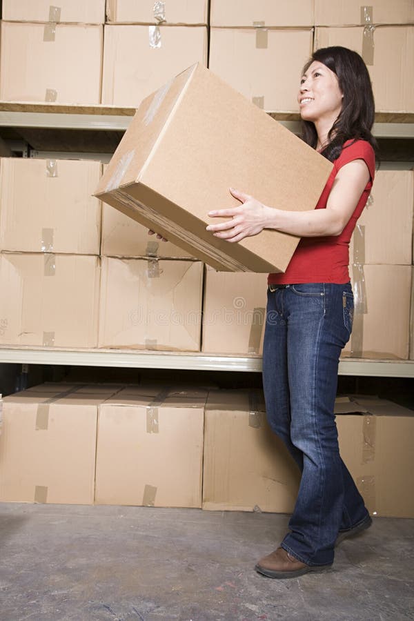 Woman with cardboard boxes stock image. Image of brown - 62806189