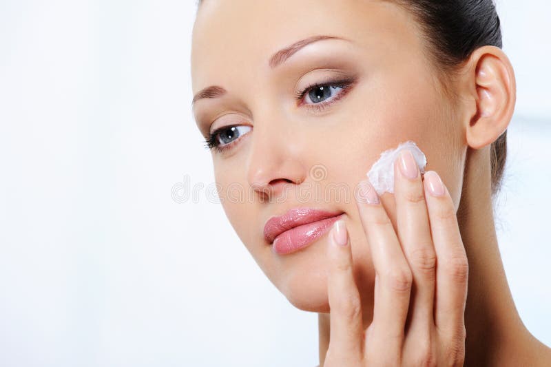 Woman Caring of Her Face with Moisturizer Cream Stock Image - Image of ...