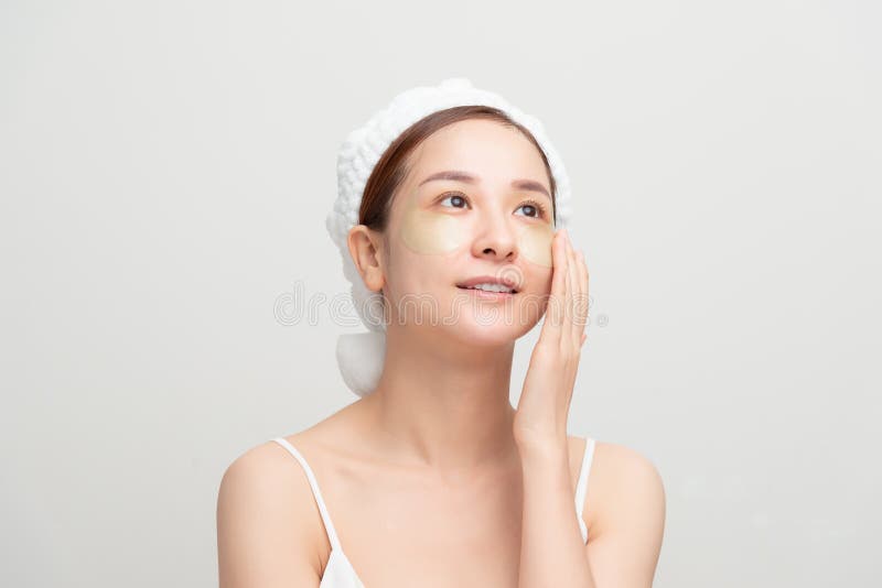 A Woman Caring for Her Face with Patches Stock Photo - Image of ...