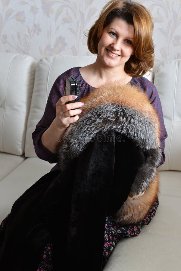 Woman Caring for Natural Fur Coat Stock Image - Image of woman, divan ...
