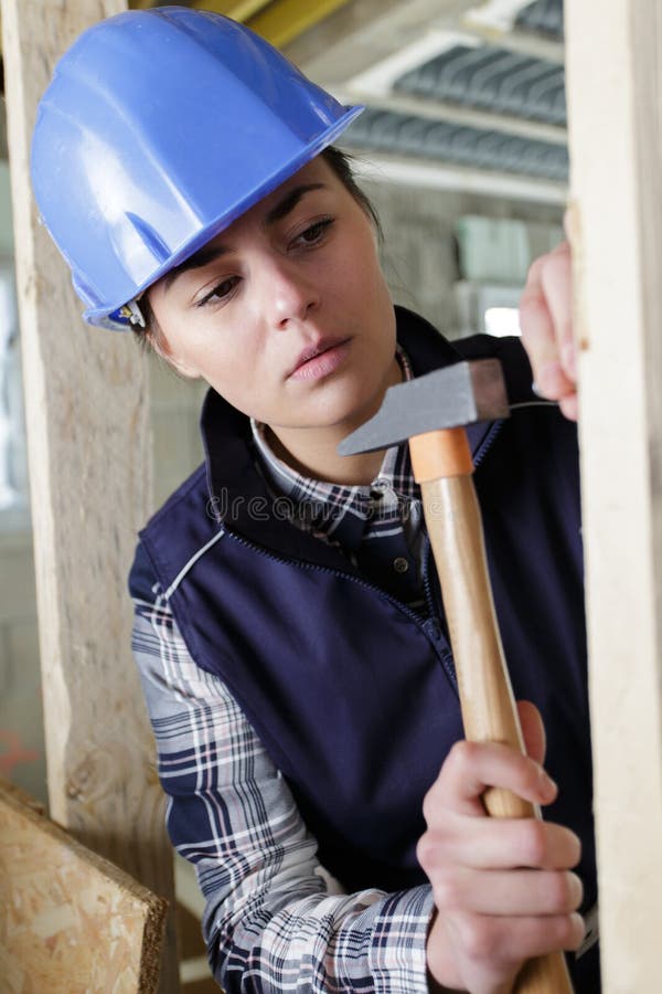 Woman Carpenter Using Hammer Pushing Nail on Wood Stock Image - Image ...