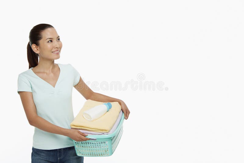 Young Woman Doing the Laundry Stock Photo - Image of length, cheerful ...