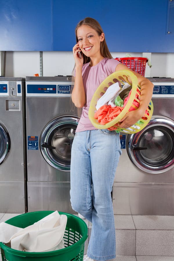 Happy Housewife Woman in Laundry Room with Washing Machine Stock Photo ...