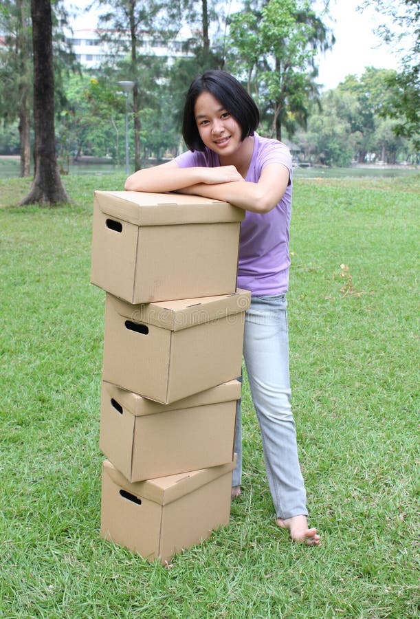 Woman Carrying Moving Boxes Stock Photo - Image of indoors, happy: 33490482