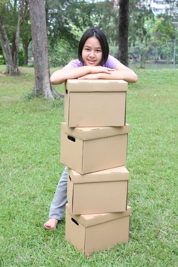 Woman Carrying Moving Boxes Stock Image - Image of body, indoors: 33490501