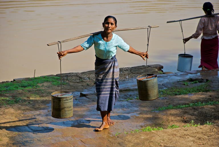 Woman carrying water editorial stock image. Image of vacation - 25886164