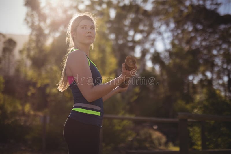 Woman Carrying Wooden Log during Obstacle Course Stock Photo - Image of ...