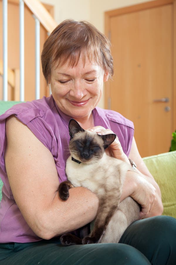 Woman with cat stock photo. Image of woman, care, person - 44720650