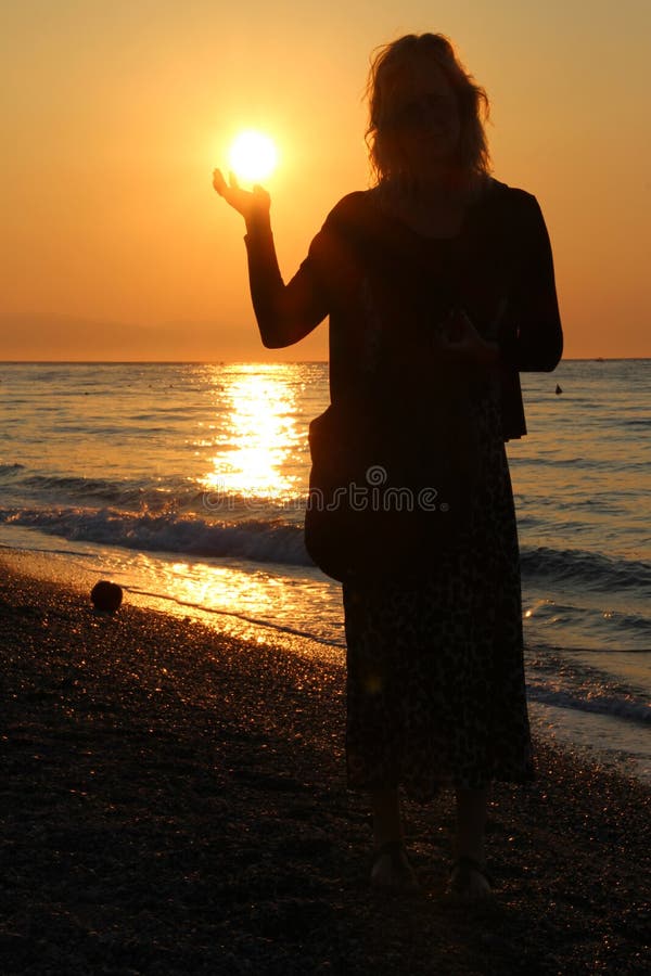 Woman catch the sunrise stock image. Image of orange - 57327459