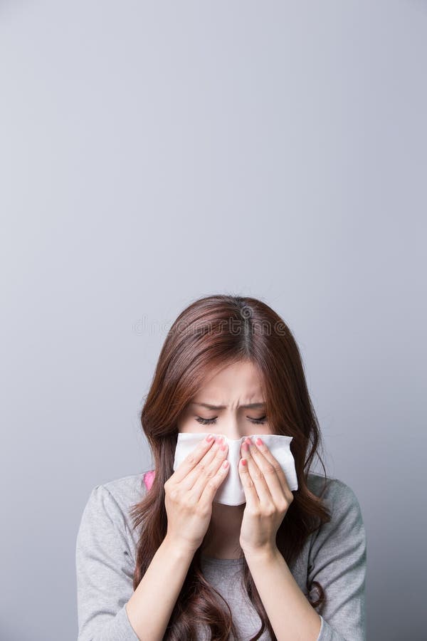 A Woman catches a cold stock image. Image of influenza - 69206607