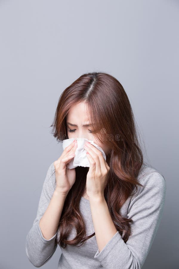A Woman catches a cold stock image. Image of influenza - 69206607