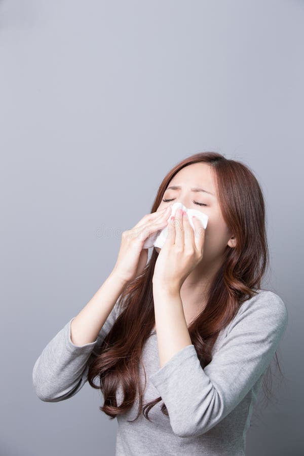 A Woman catches a cold stock image. Image of influenza - 69206607