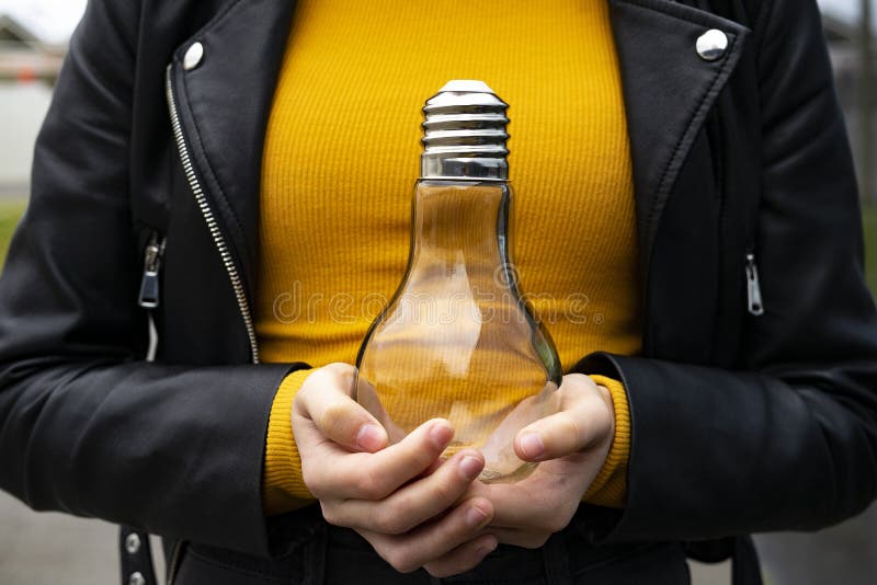 Woman Catching a Light Bulb Stock Image - Image of light, electricity ...