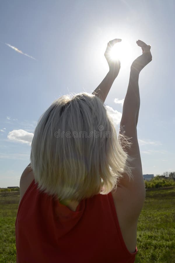 Woman catching sun stock photo. Image of blond, woman - 71028786