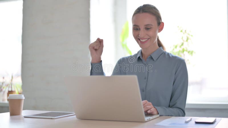 Woman Celebrating Success while Using Laptop in Office Stock Image ...