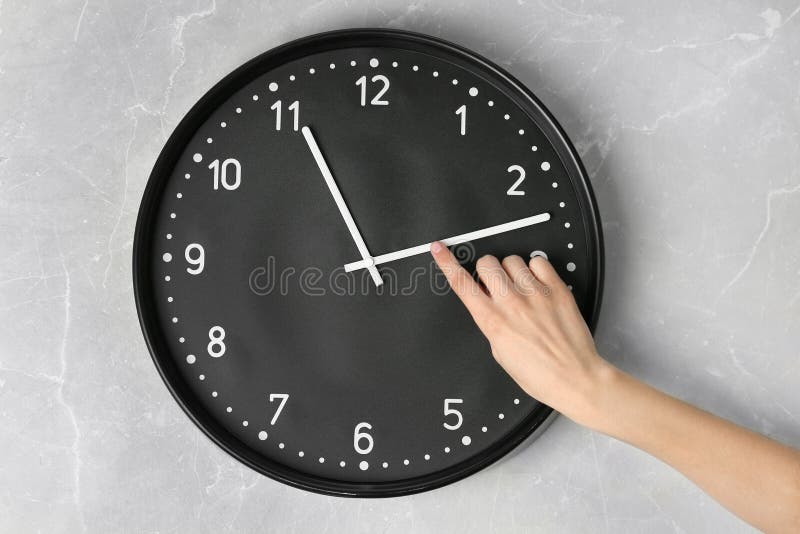 Woman Changing Time on Big Clock Stock Photo - Image of hand, country ...
