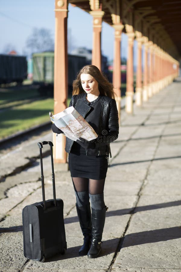 Woman check route on map stock photo. Image of body, driving - 48892010