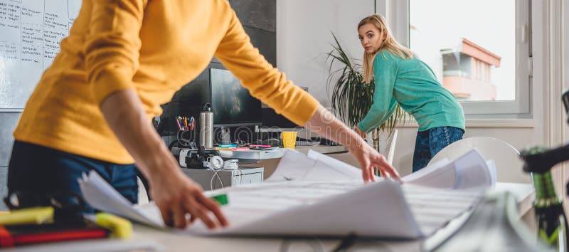 Woman checking blueprints stock photo. Image of indoors - 91847580