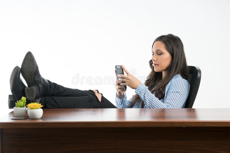 Woman Checking Cellphone in Office Stock Photo - Image of confidence ...