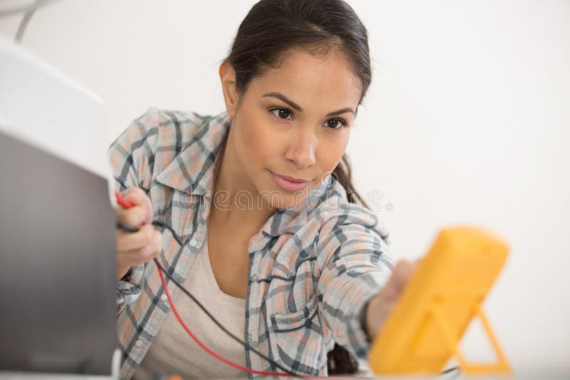 Woman Checking Computer with Multimeter Stock Photo - Image of plug ...