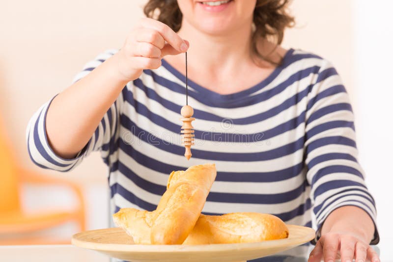 Woman Checking Food Pendulum Stock Photos - Free & Royalty-Free Stock ...