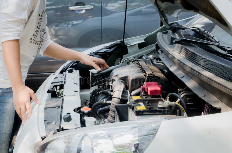 Woman checking her car stock photo. Image of level, broken - 37491516