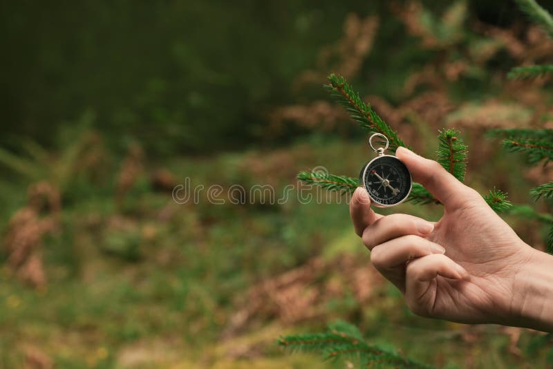 Woman Checking Modern Compass in Wilderness Stock Image - Image of ...