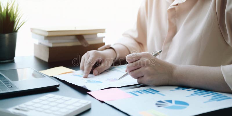 Woman Checking Paperwork from Accounting Department To Analyse Number ...