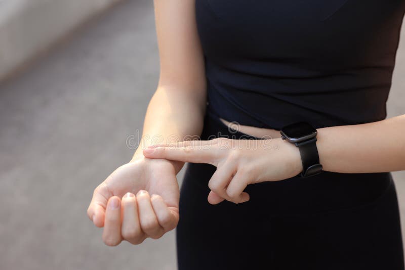 Woman Checking Pulse after Training Outdoors, Closeup Stock Image ...