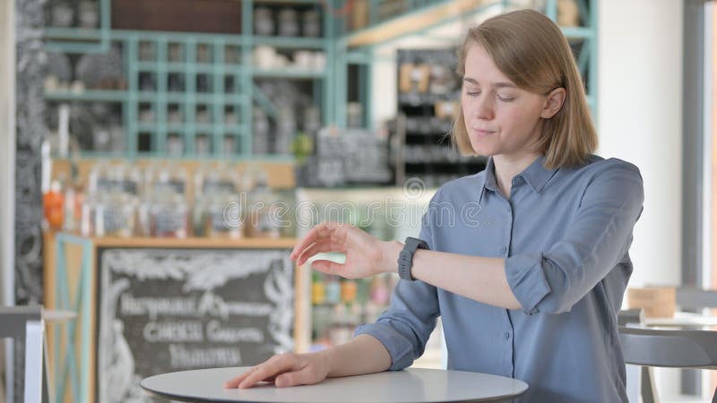 Young Woman Checking Watch while Waiting Stock Photo - Image of urgency ...